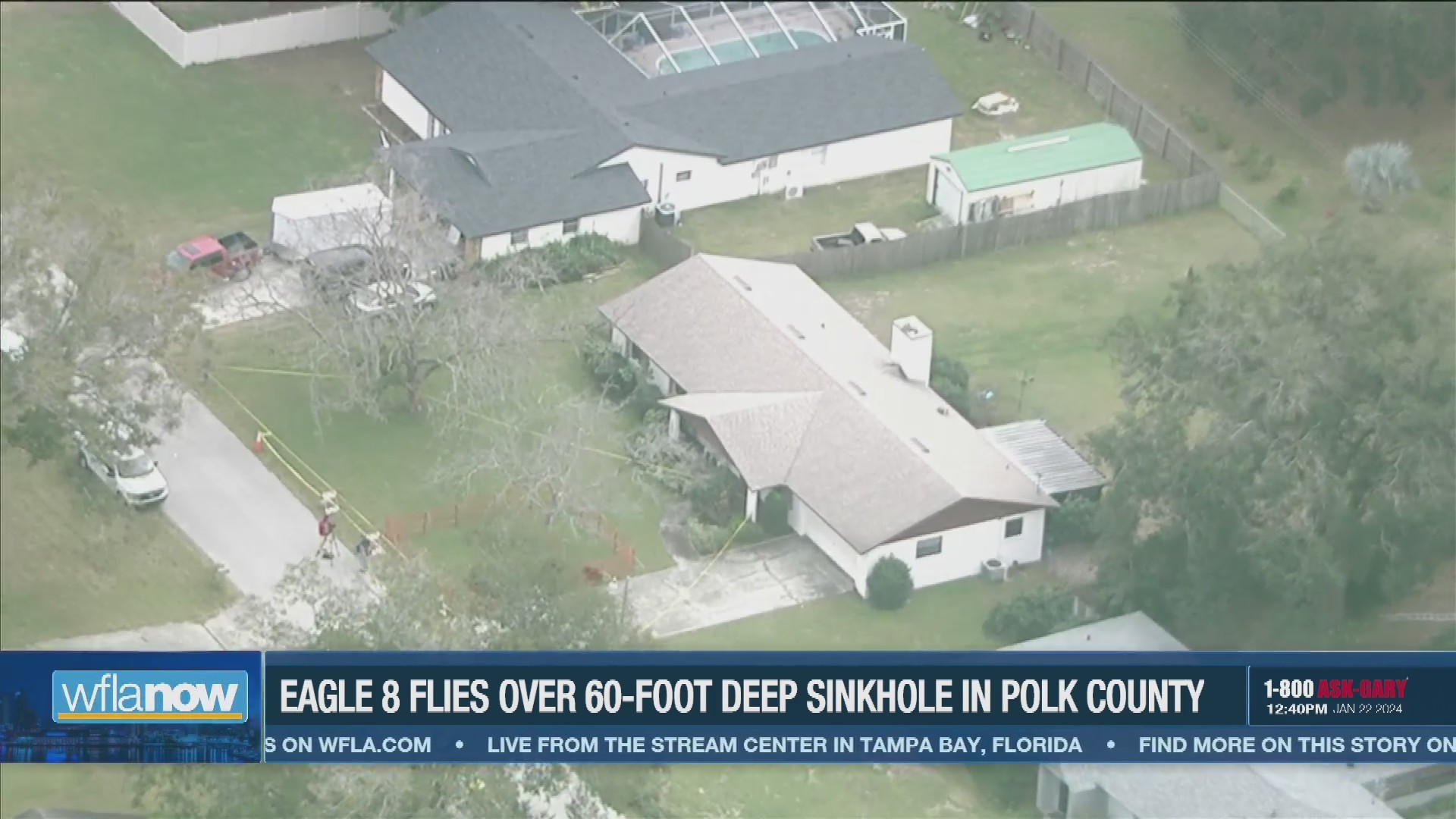 60-foot-deep sinkhole opens in front of Polk County home, officials say ...
