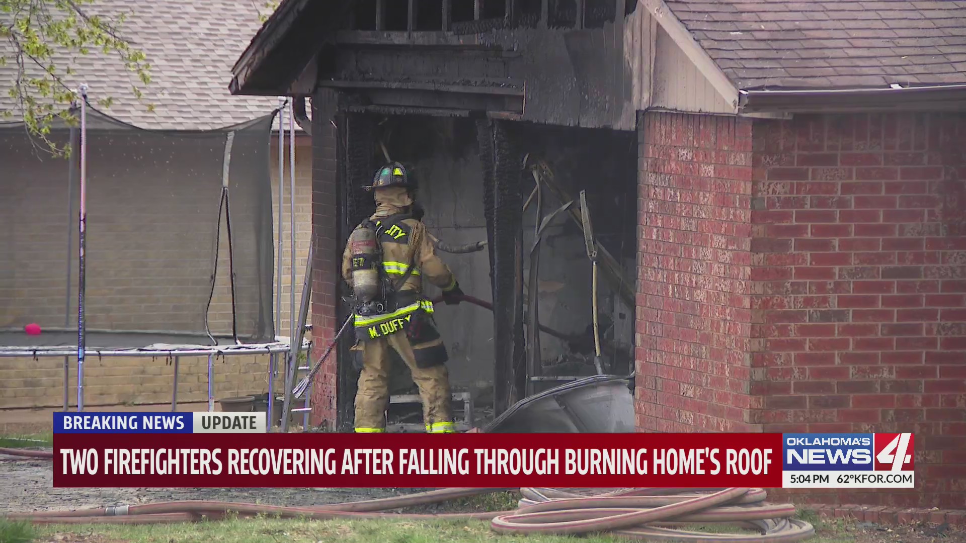 Two firefighters recovering after falling through burning home’s roof ...