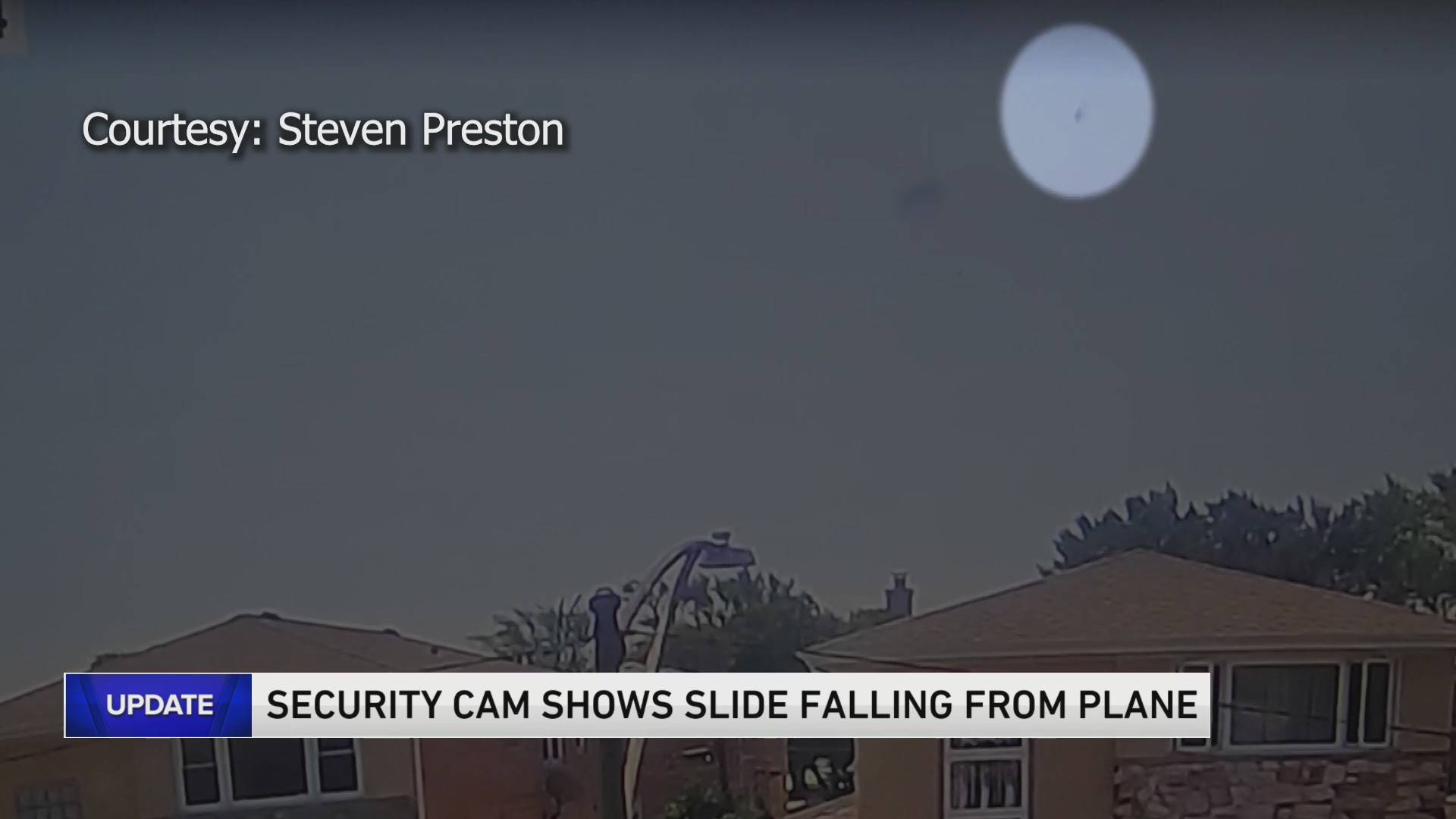 VIDEO: Security camera footage shows slide falling from plane on NW ...