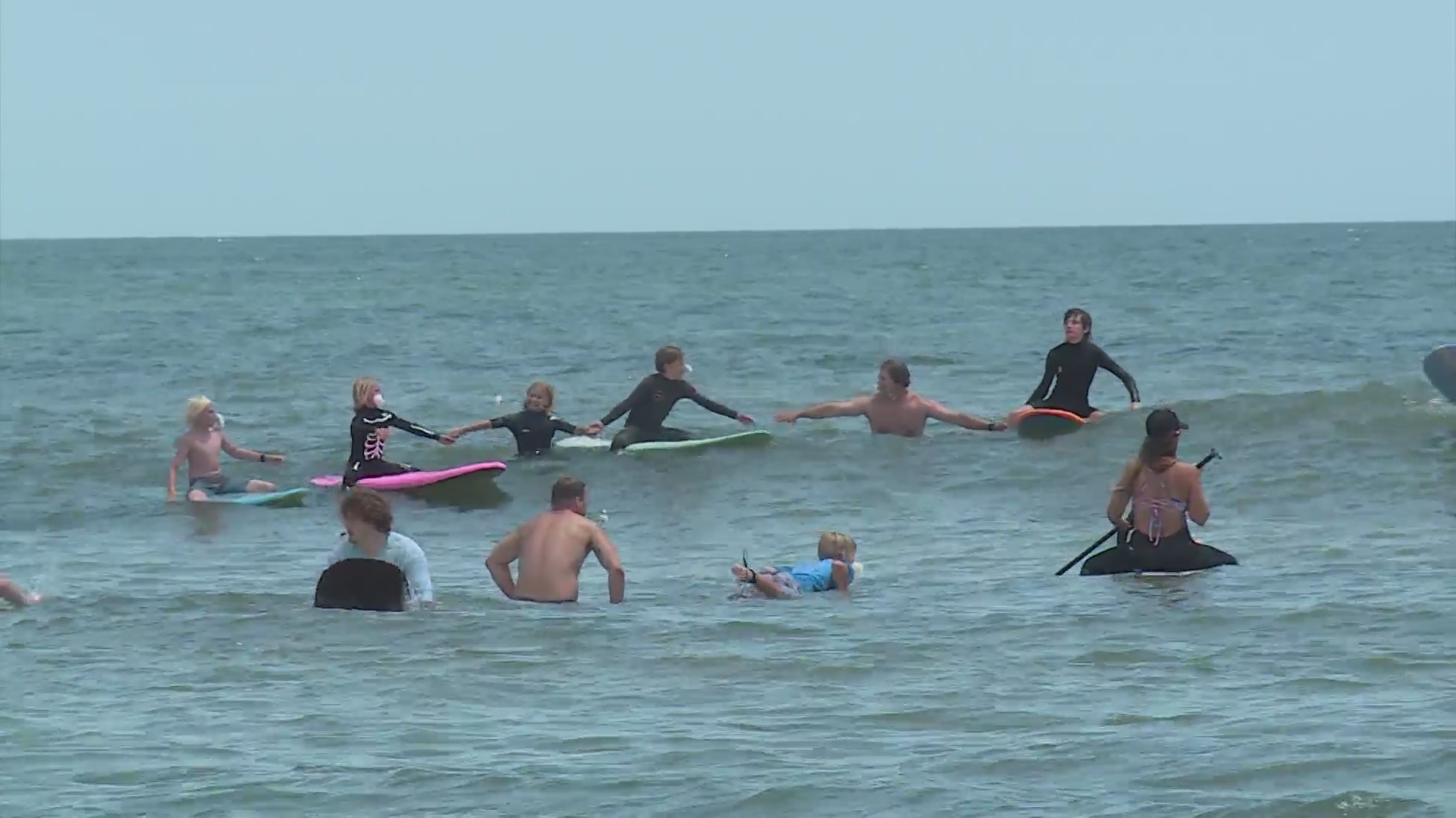 Surfers honor fallen military with paddle-out at Oceanfront – WAVY.com