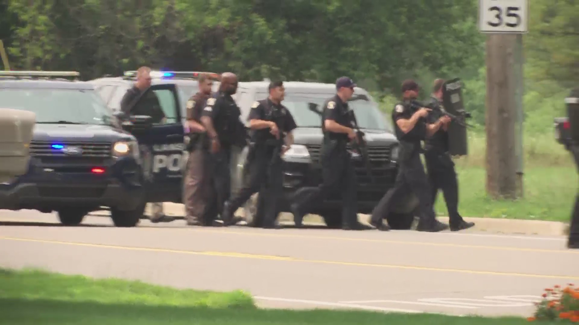 Police, fire departments blocking Michigan Ave, officers have guns ...