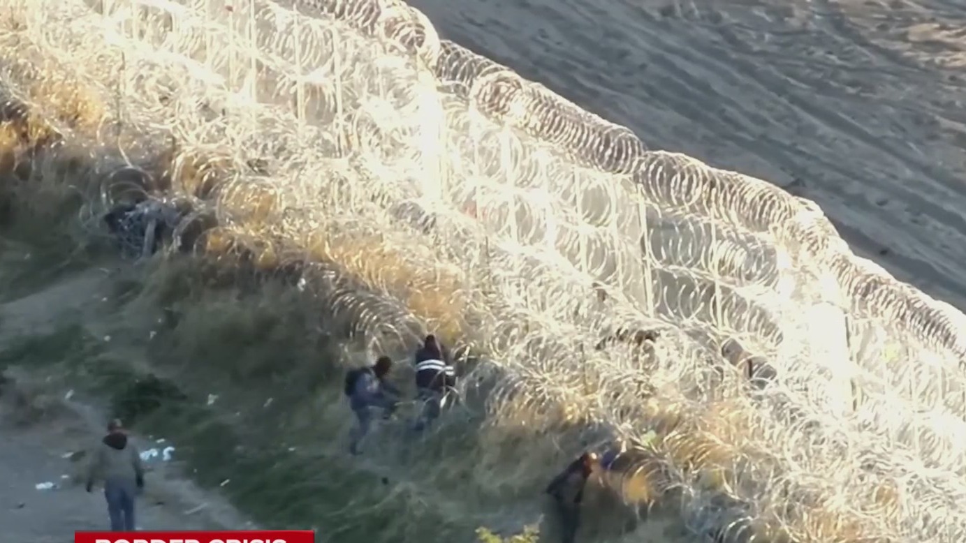 Migrants try to cut through razor wire at Texas border, video shows ...