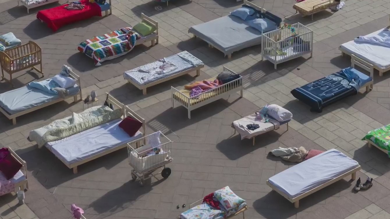 230 empty beds, bassinets were staged in Jerusalem representing ...