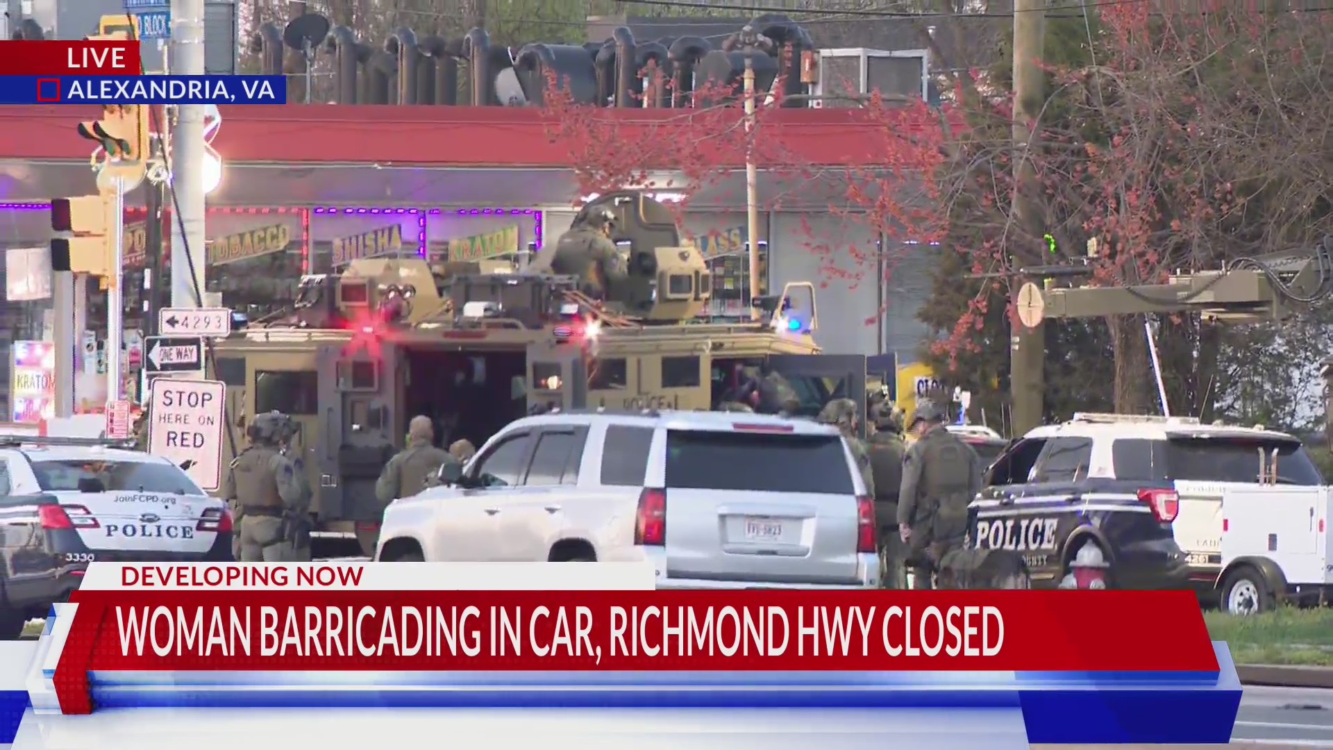 Almost 24 hours later, woman with gun still barricaded in car in ...
