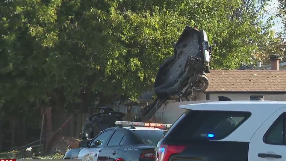 Vehicle ends up partially on a roof after a crash, officials say ...