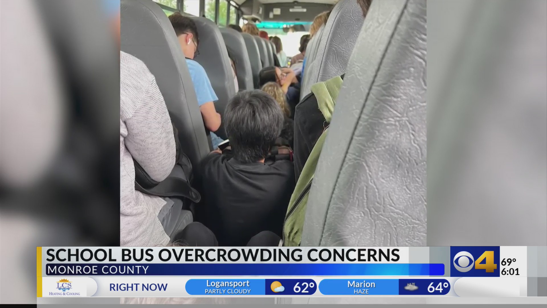 Photo of Bloomington kids sitting in the aisle of a crowded school bus ...