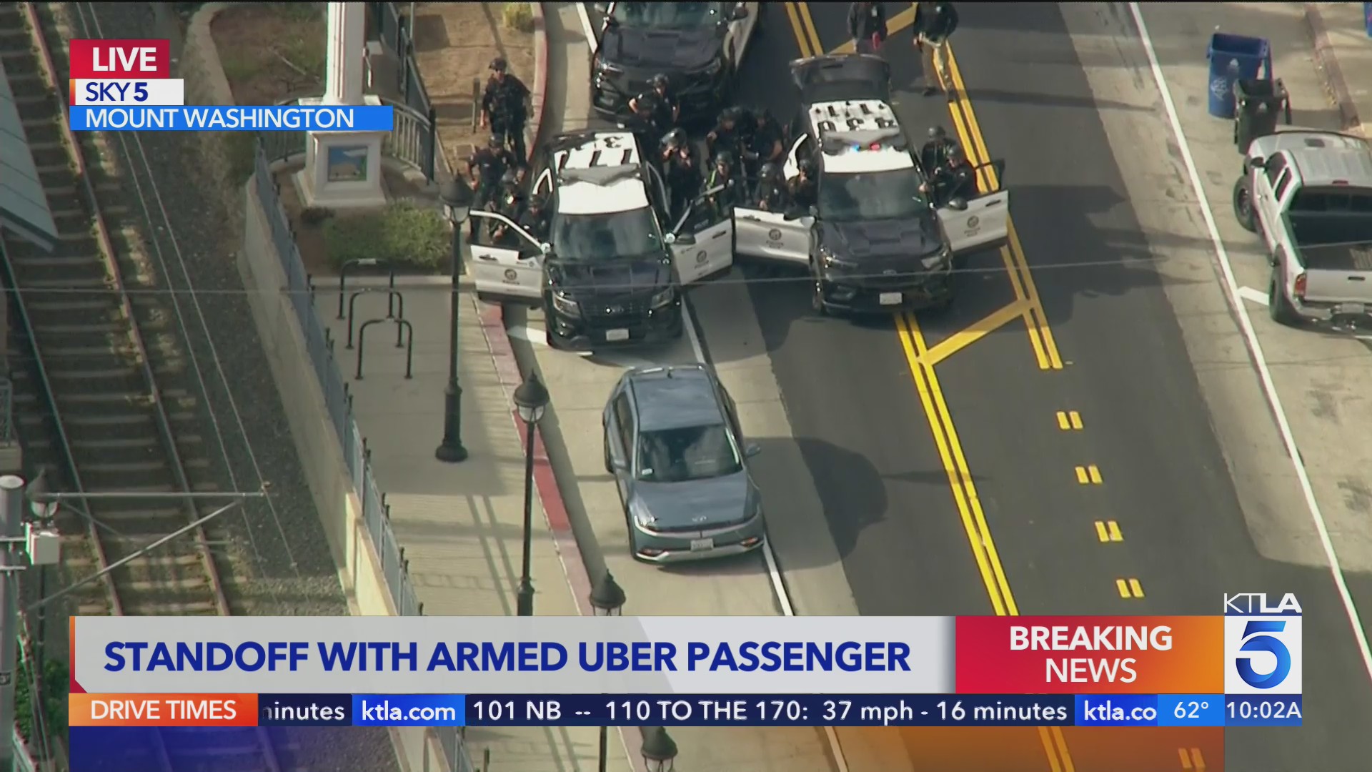Police standoff continues with Uber passenger armed with a gun – KTLA