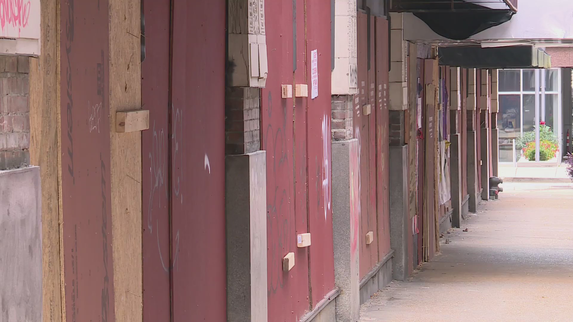 Metal security plates removed from Railway Exchange Building exterior ...