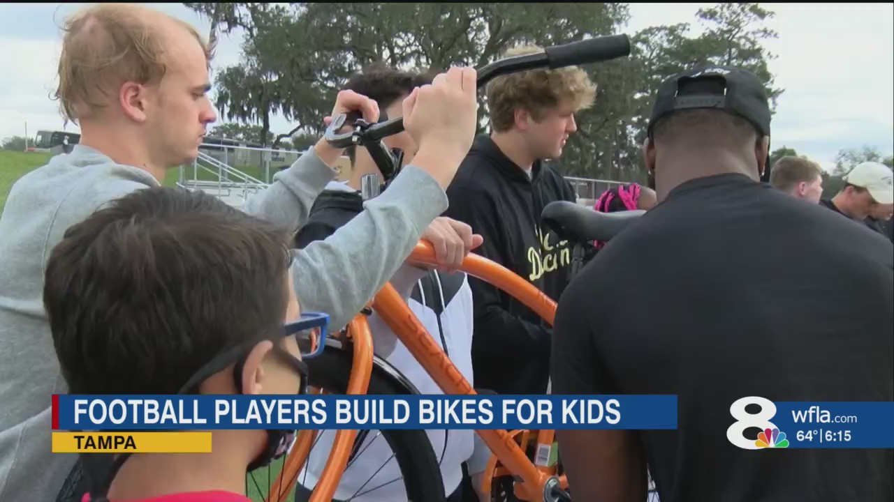 Football players build bikes for local kids – WFLA