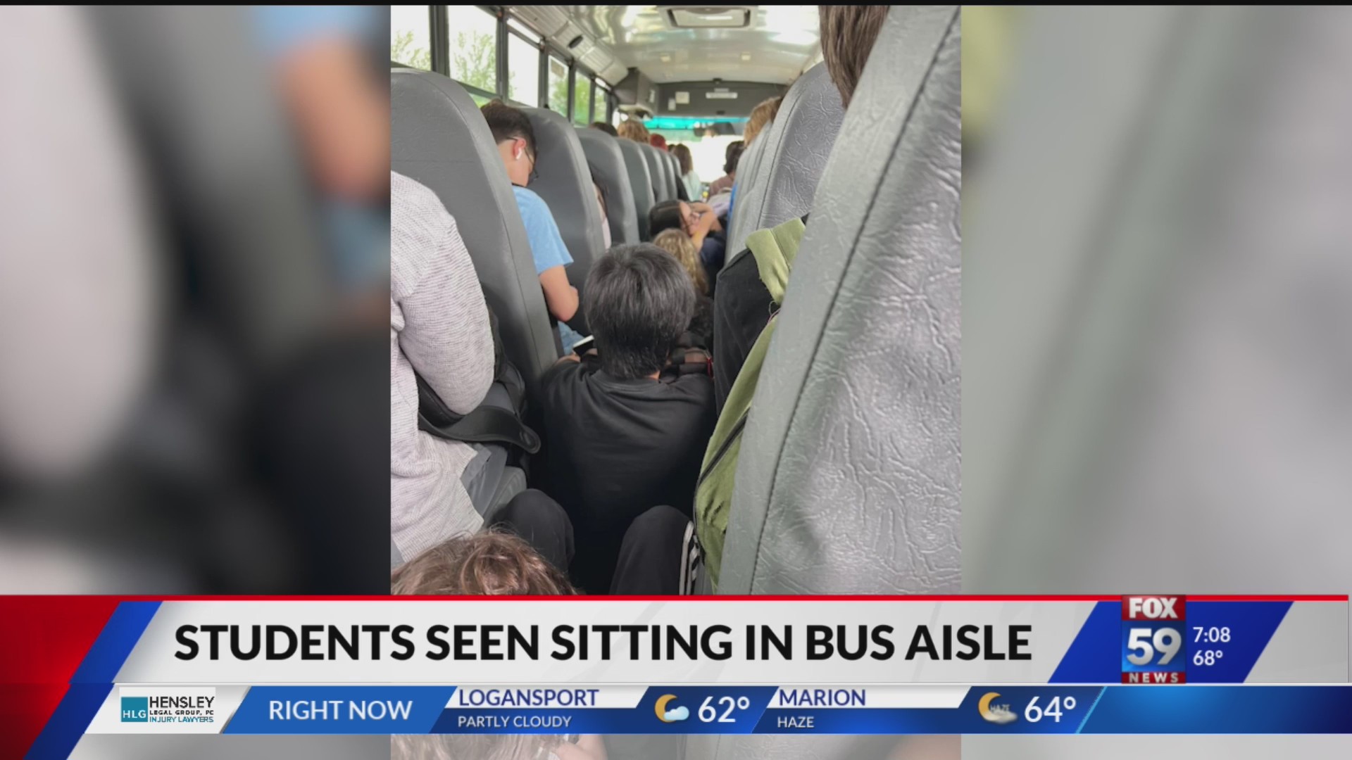 Bloomington students seen sitting in the aisle of a crowded school bus ...