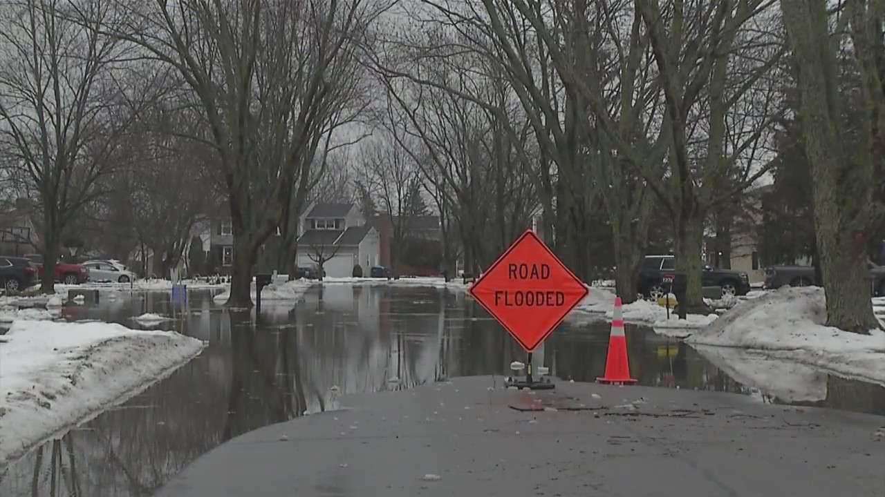 ‘It’s thigh high’: Neighbors react as flooding closes roadways across ...