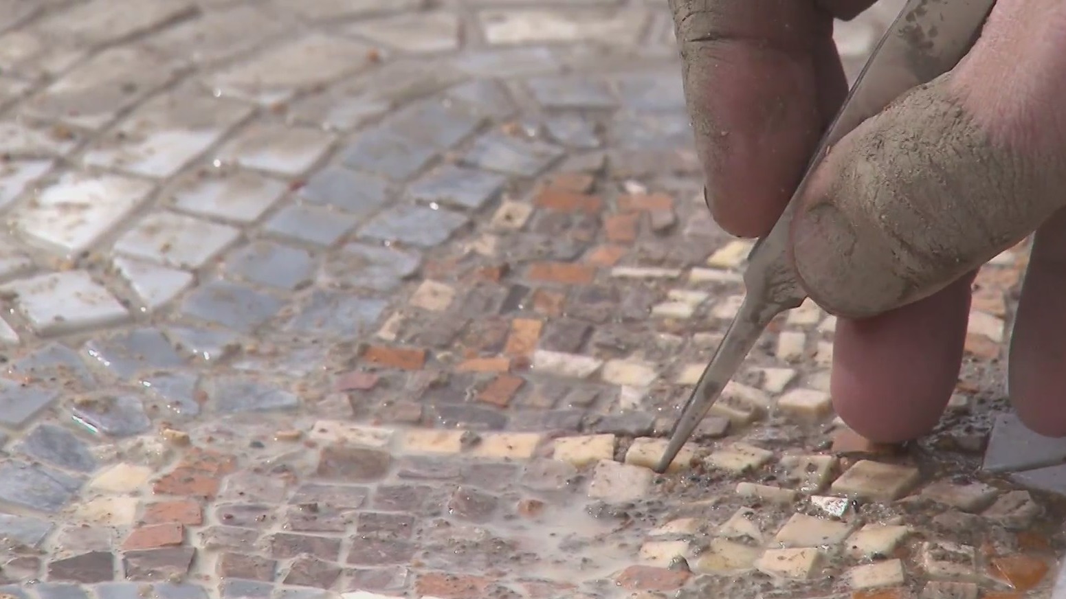 Beautifying Chicago’s street craters: Local artist turning potholes ...