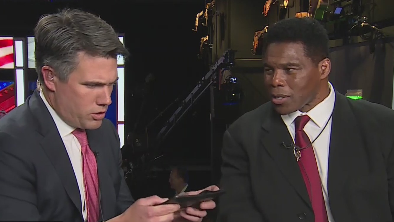 Walker shows Leland Vittert his badge | GA Senate Debate – NewsNation