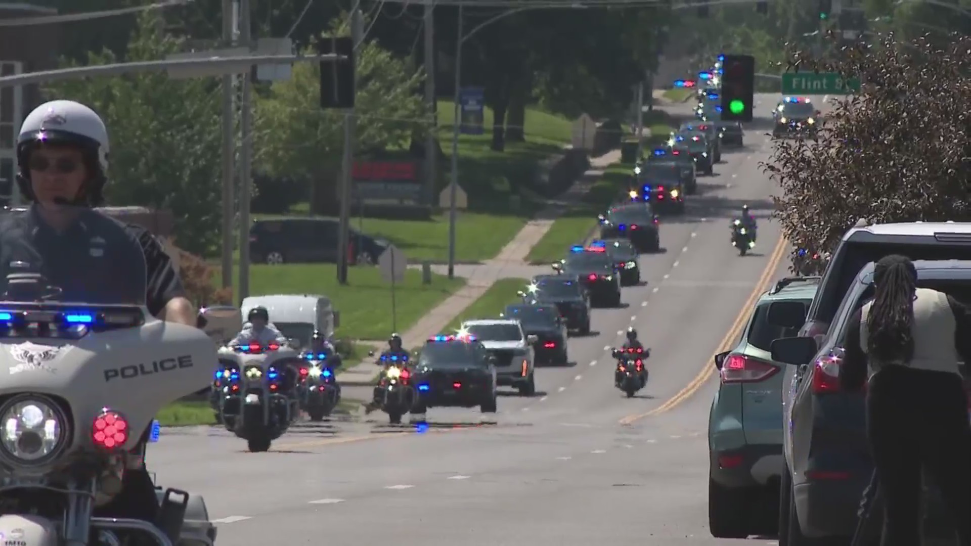 Dozens of police officers honor fallen Fairway officer with procession ...